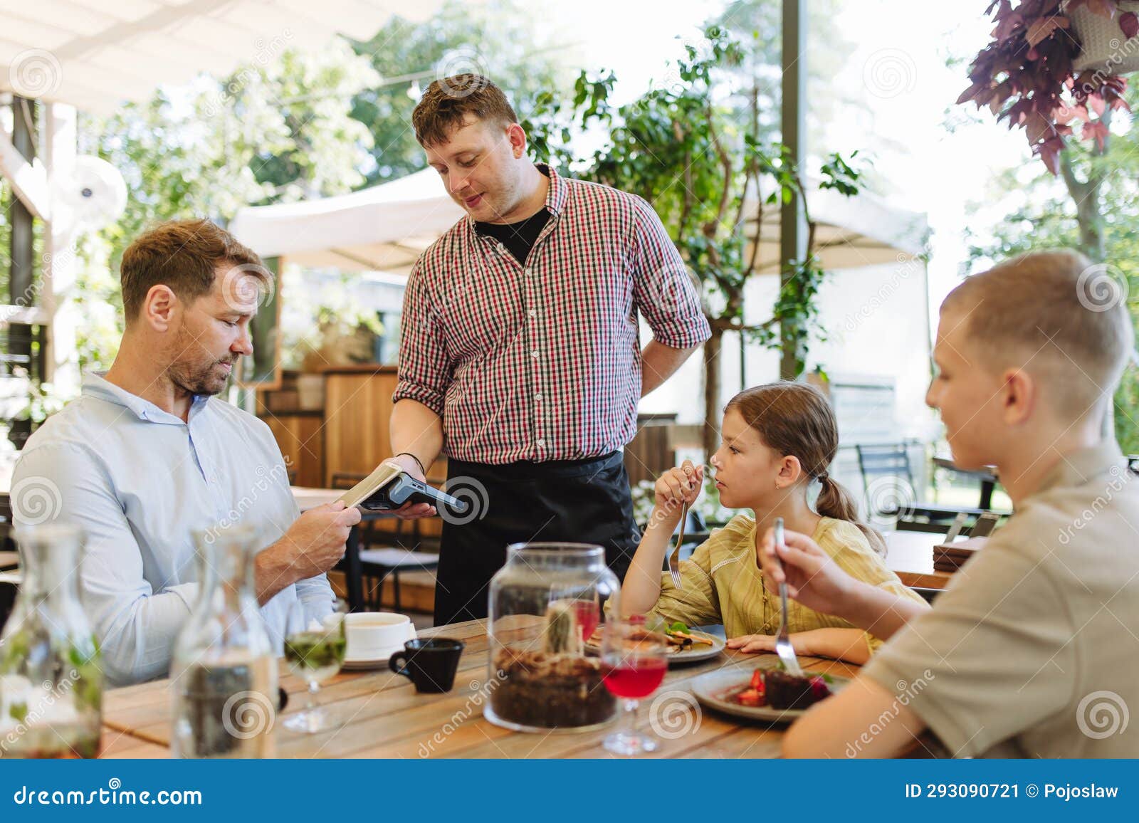 Man Paying for Lunch in Restaurant, Paying by Card. Holding Card Near ...