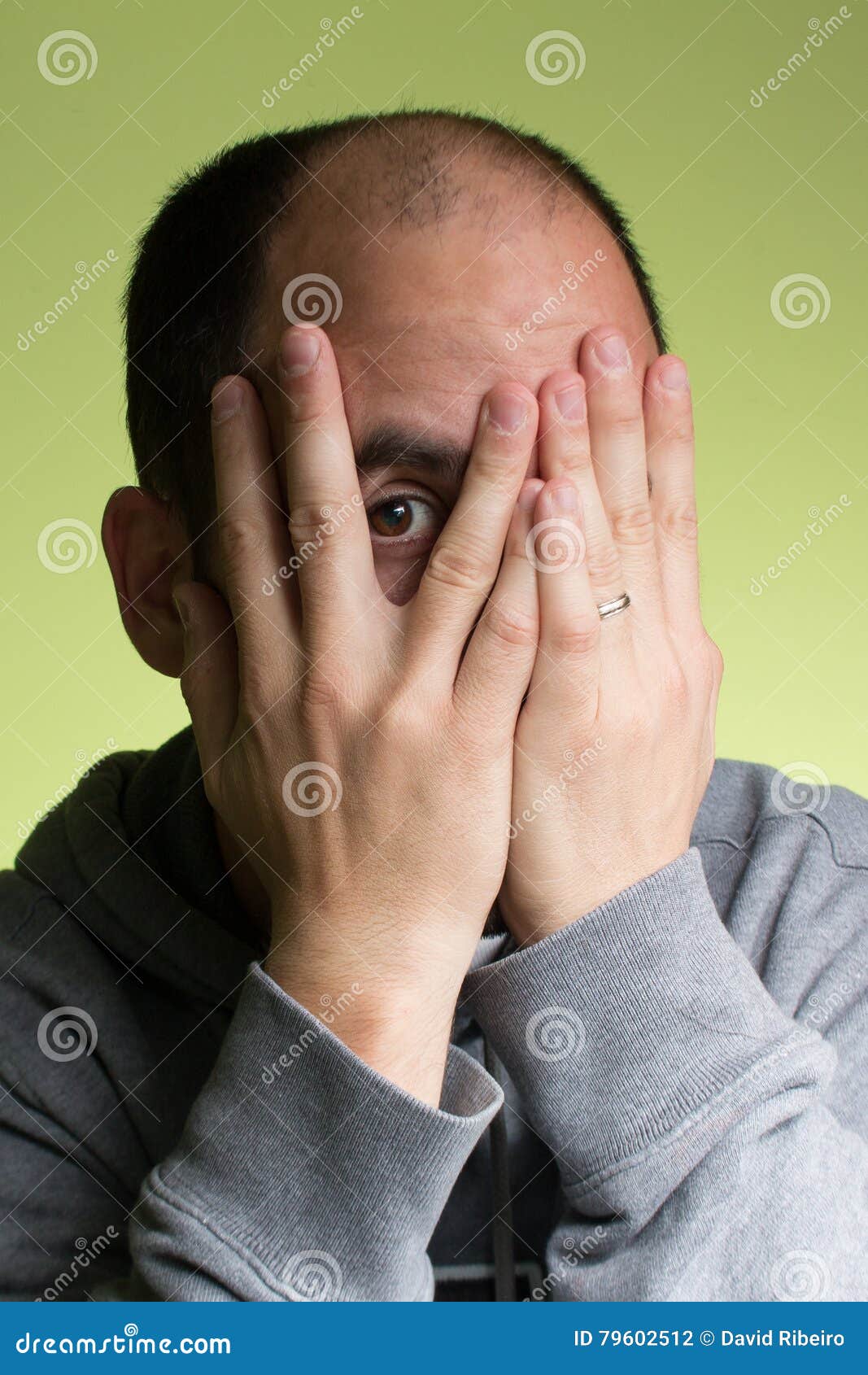Man Peeking Hands Stock Images - Download 447 Royalty Free Photos