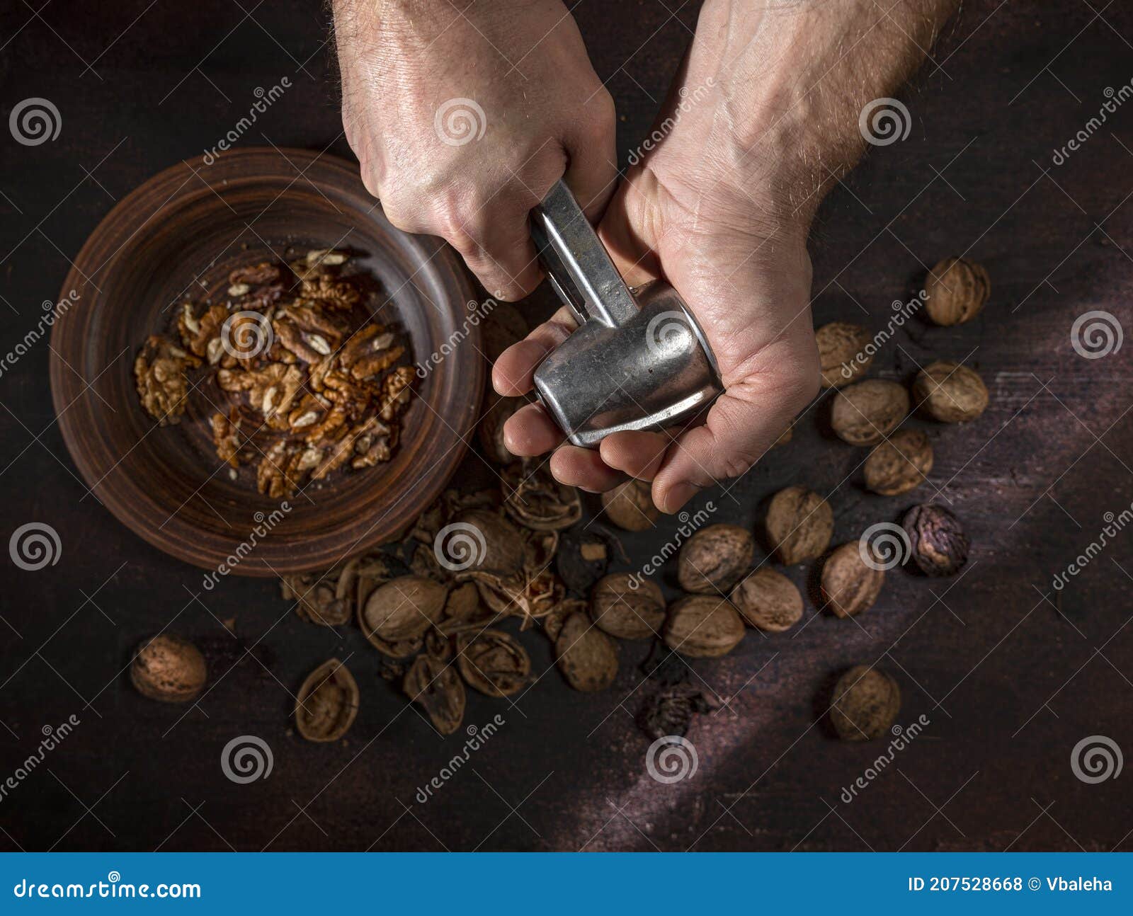 Man peeling nuts stock photo. Image of crack, tasty - 207528668
