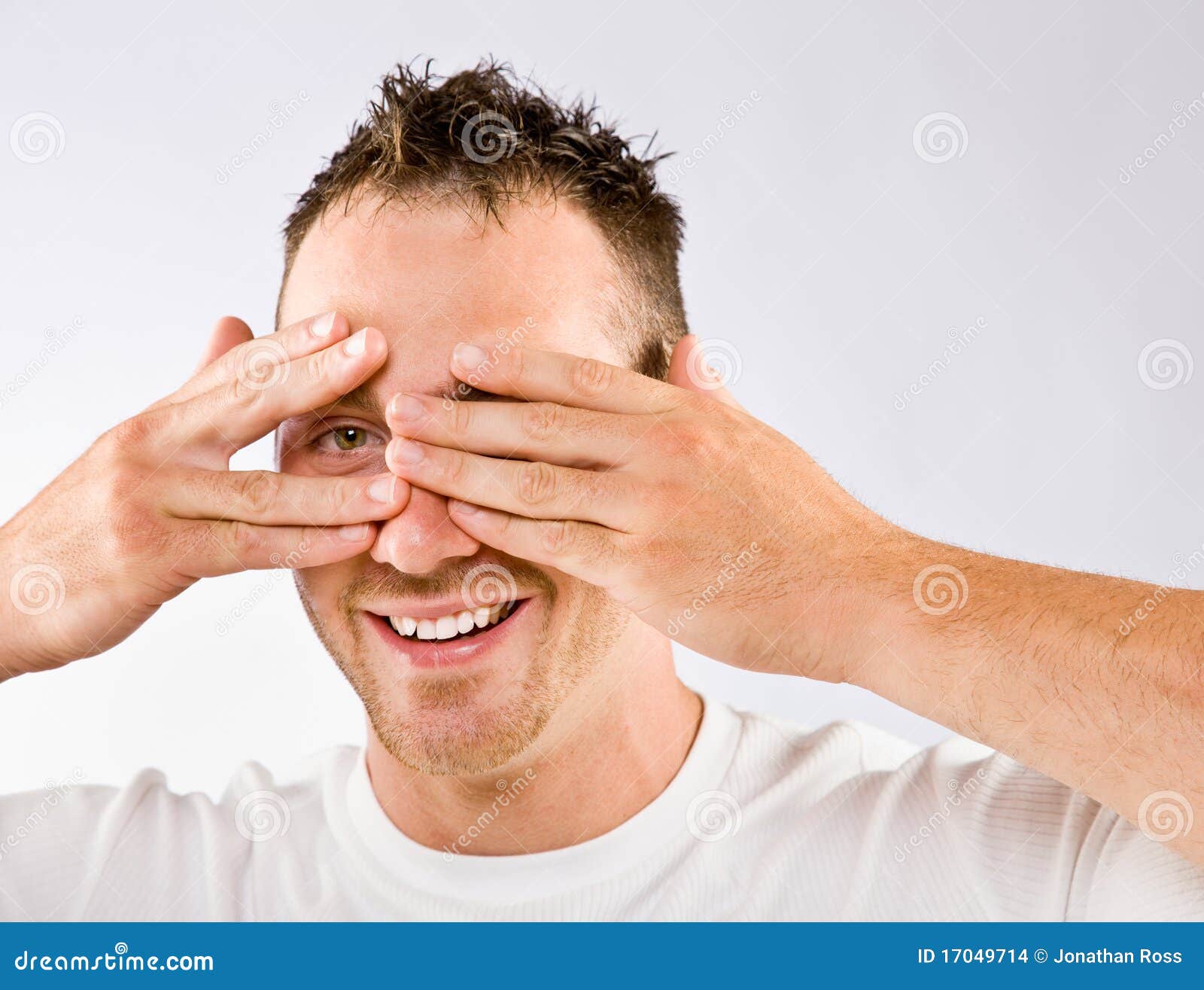 Man Peering from Behind Hands Stock Photo - Image of mischievous ...