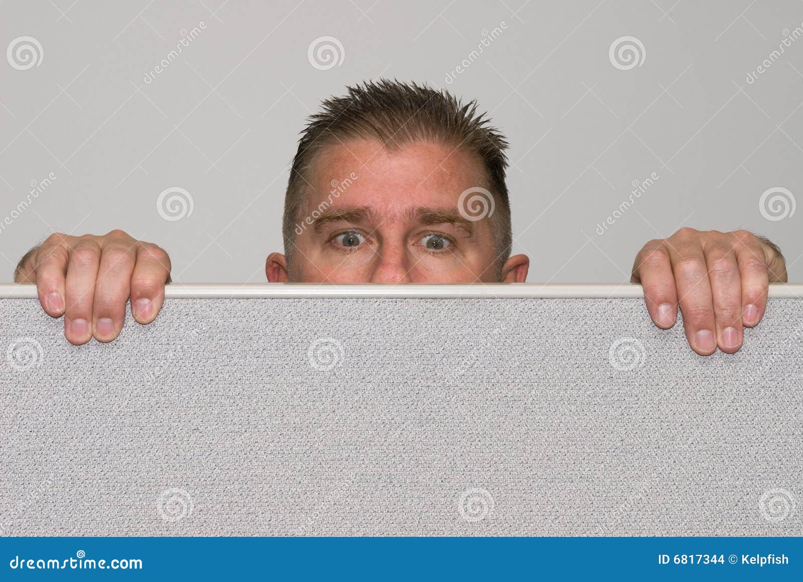Man Peering Over Office Cubicle Stock Photo - Image of worker, cubicle ...