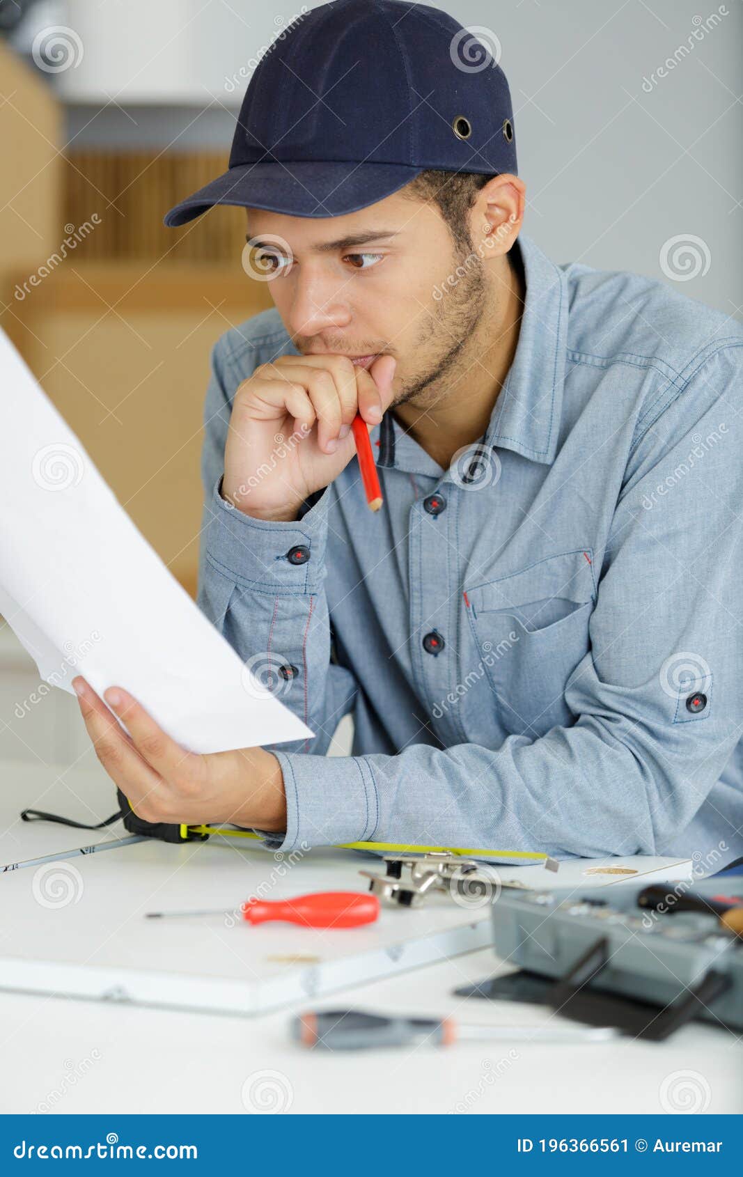 Man with Pencil Looking at Drawing Stock Image - Image of work, people ...