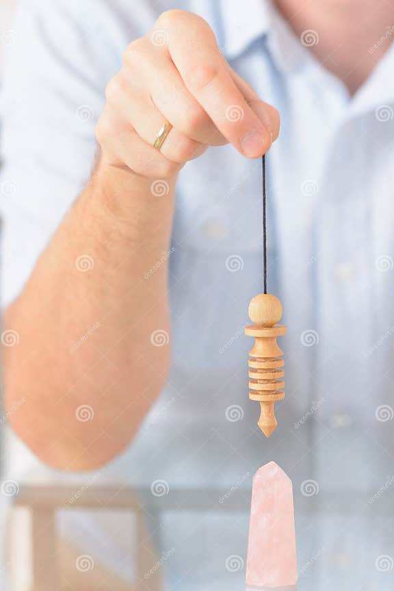 Man with pendulum stock photo. Image of hanging, esoteric - 44945876