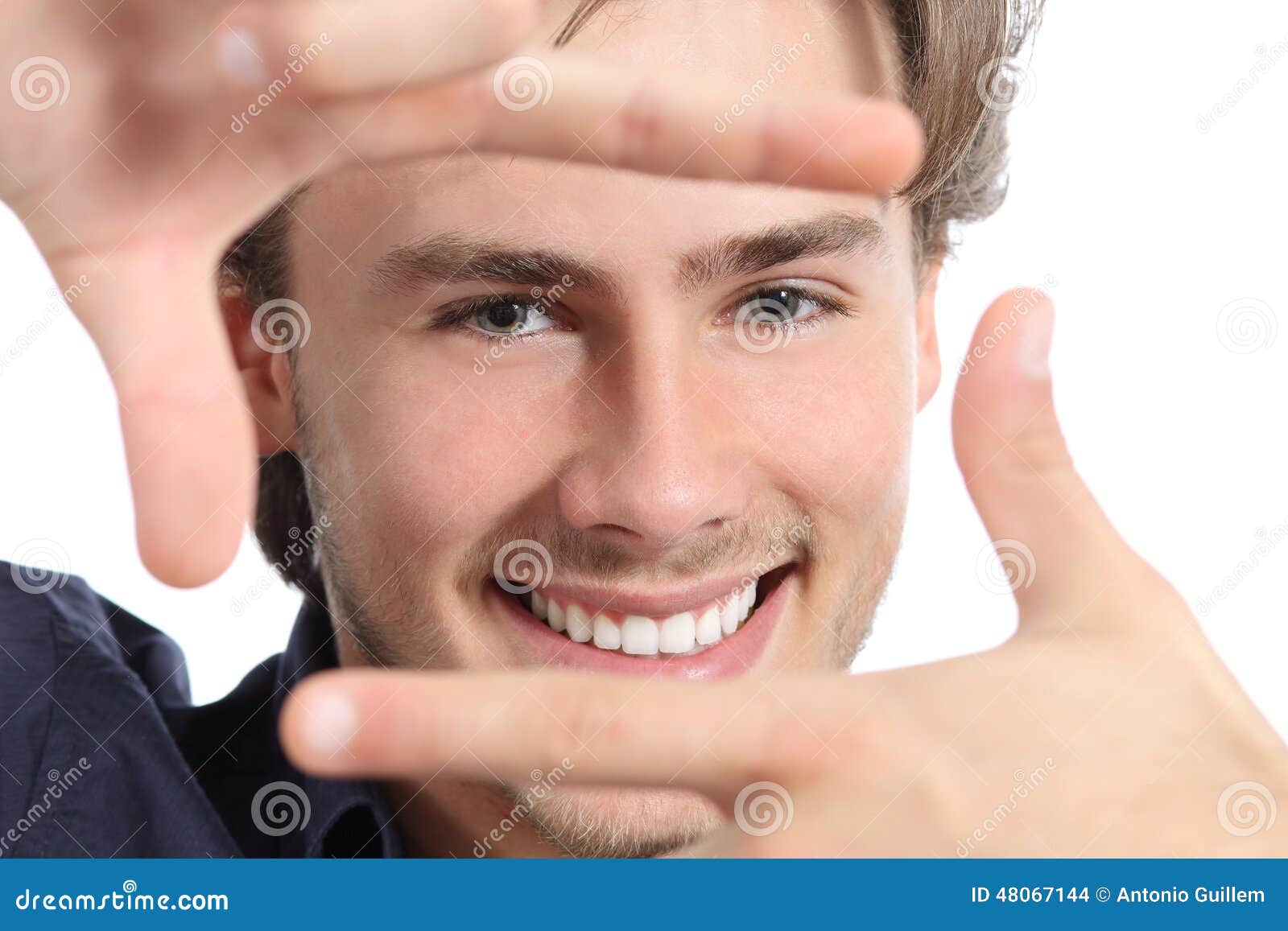 Man With Perfect White Smile Framing Face With Hands Royalty-Free Stock ...