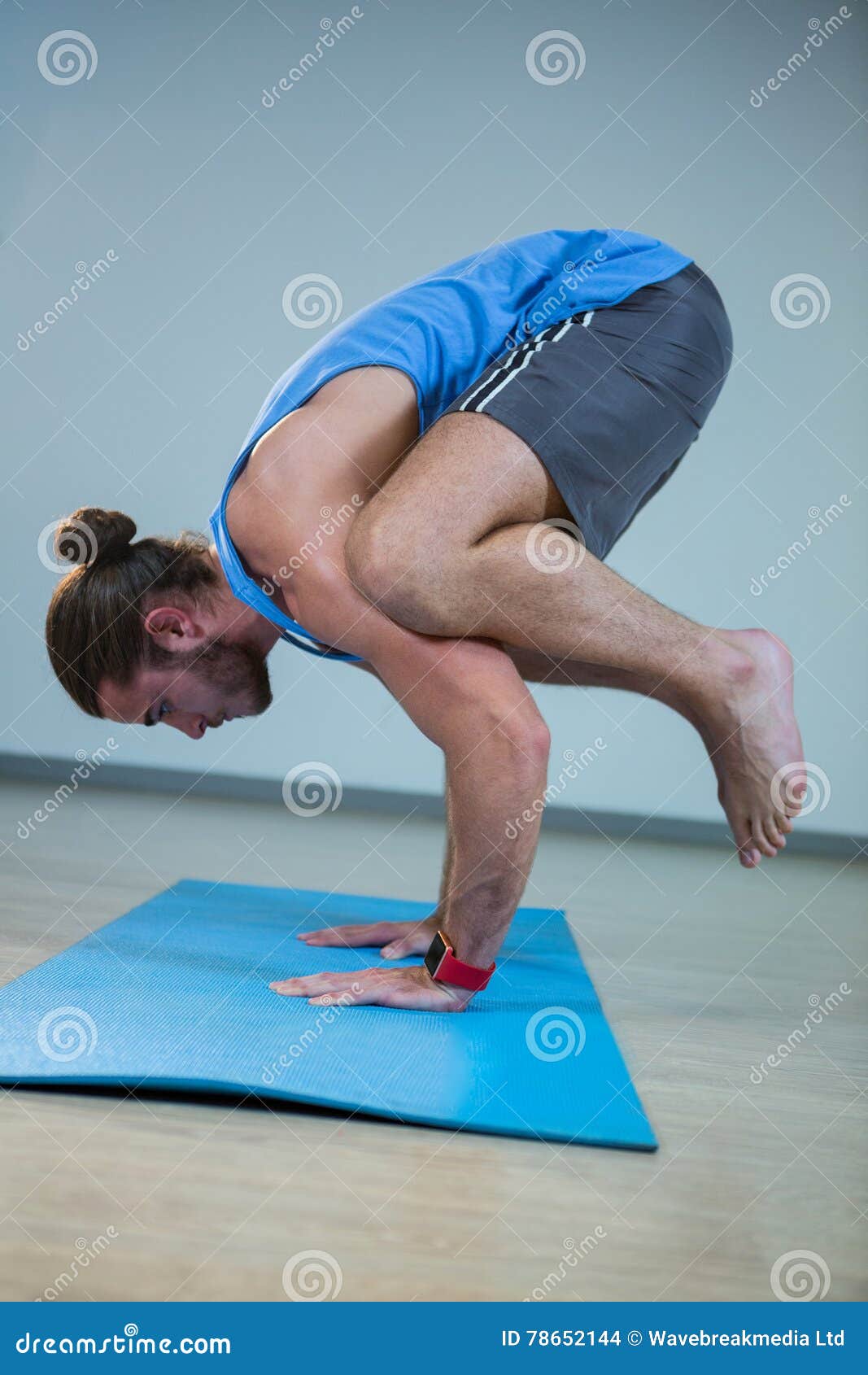 Man Performing Crow Pose on Exercise Mat Editorial Stock Image - Image ...