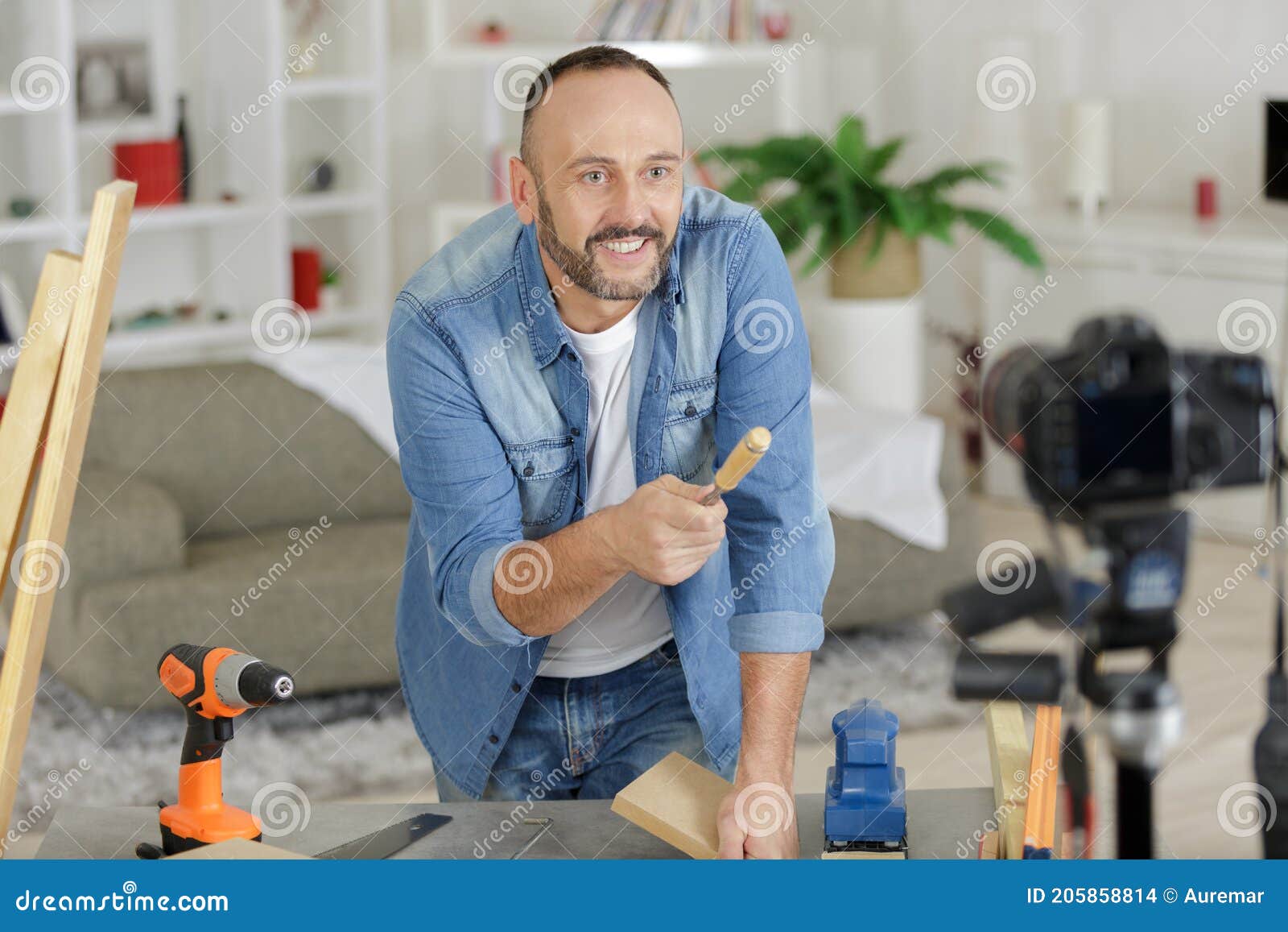 Man Performing Diy Task before Camera for Blog Stock Photo - Image of ...
