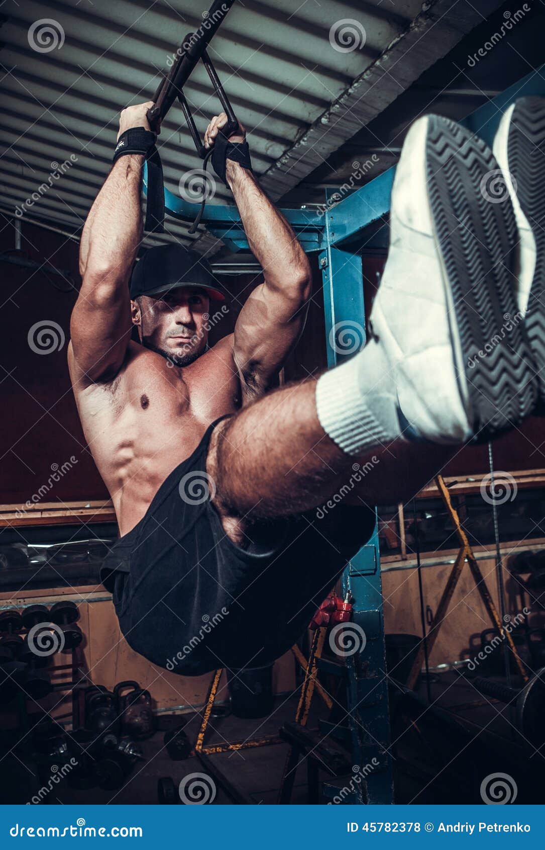 Man Performing Hanging Leg Raises Exercise Stock Photo - Image of ...