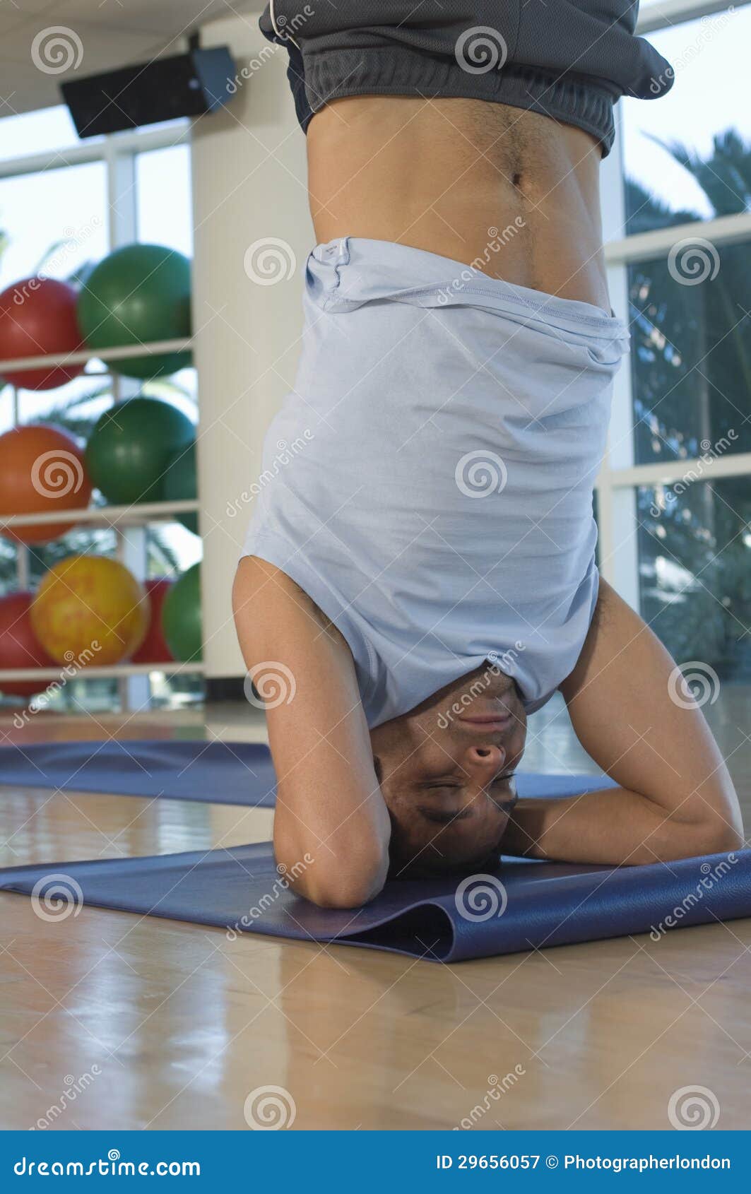 Man Performing Head Stand stock image. Image of exercise - 29656057