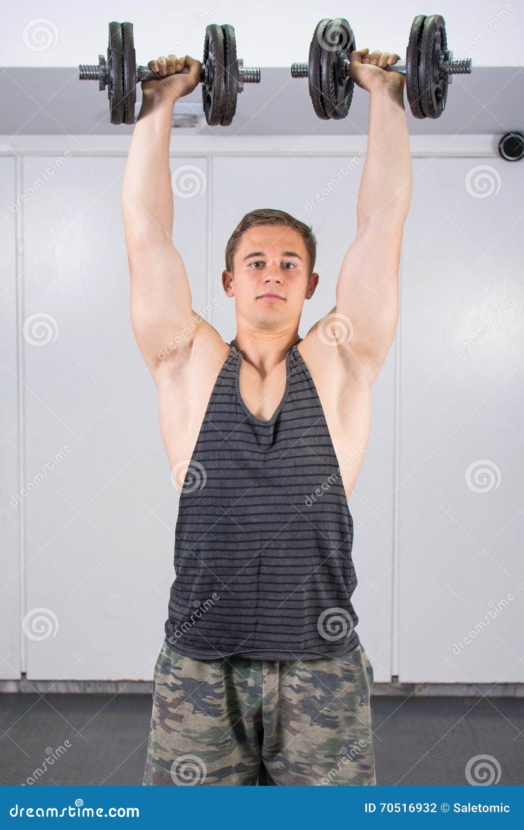 Man Performing Shoulder Workout at the Gym Stock Photo - Image of ...