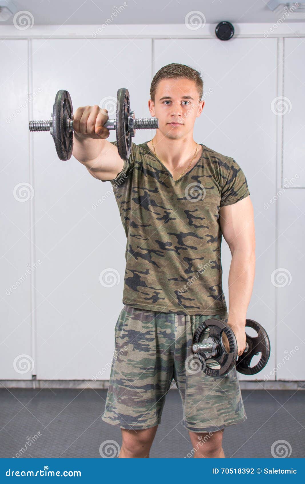 Man Performing Shoulder Workout at the Gym Stock Photo - Image of ...