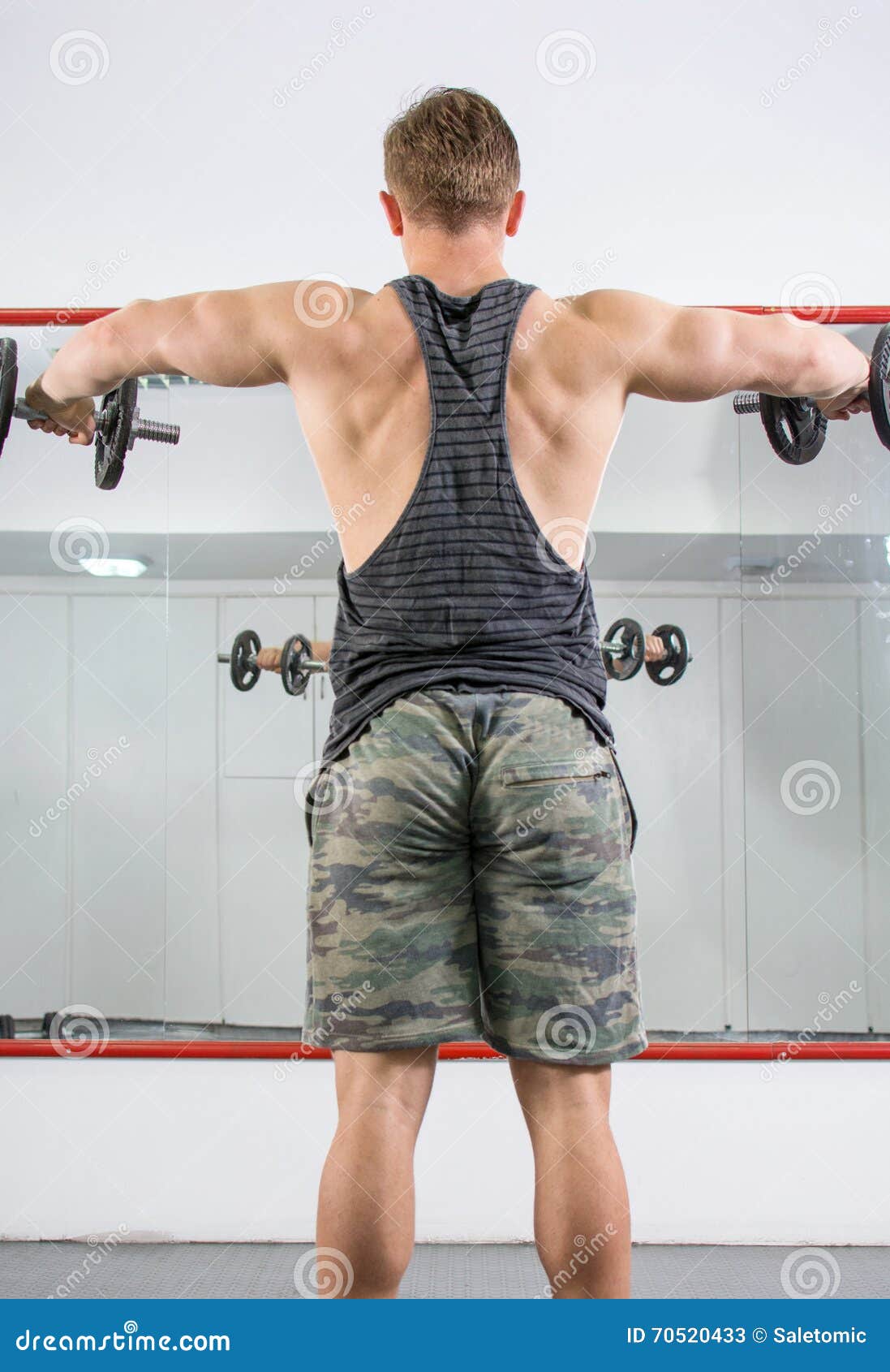 Man Performing Shoulder Workout at the Gym Stock Image - Image of heavy ...