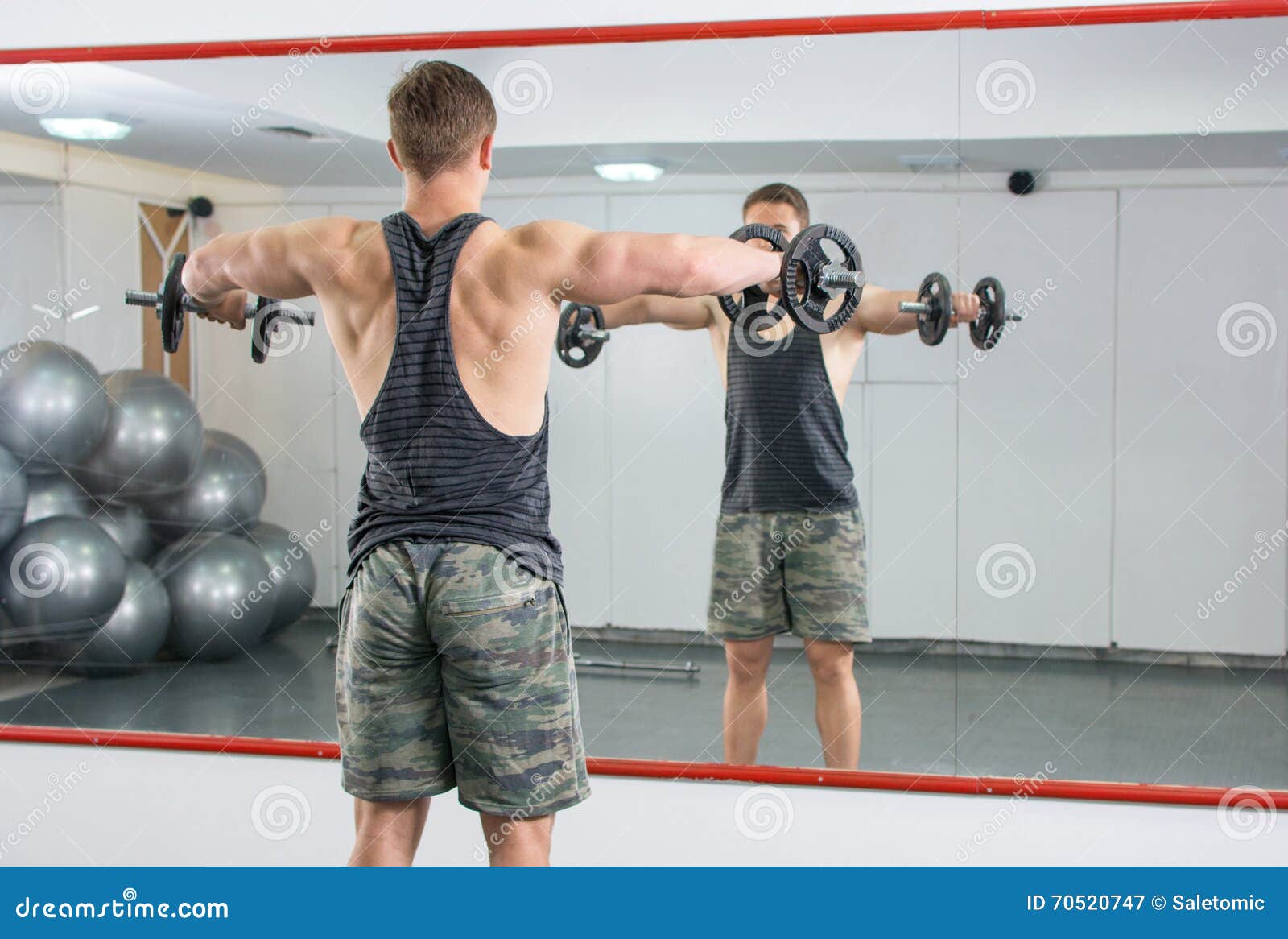 Man Performing Shoulder Workout at the Gym Stock Image - Image of raise ...