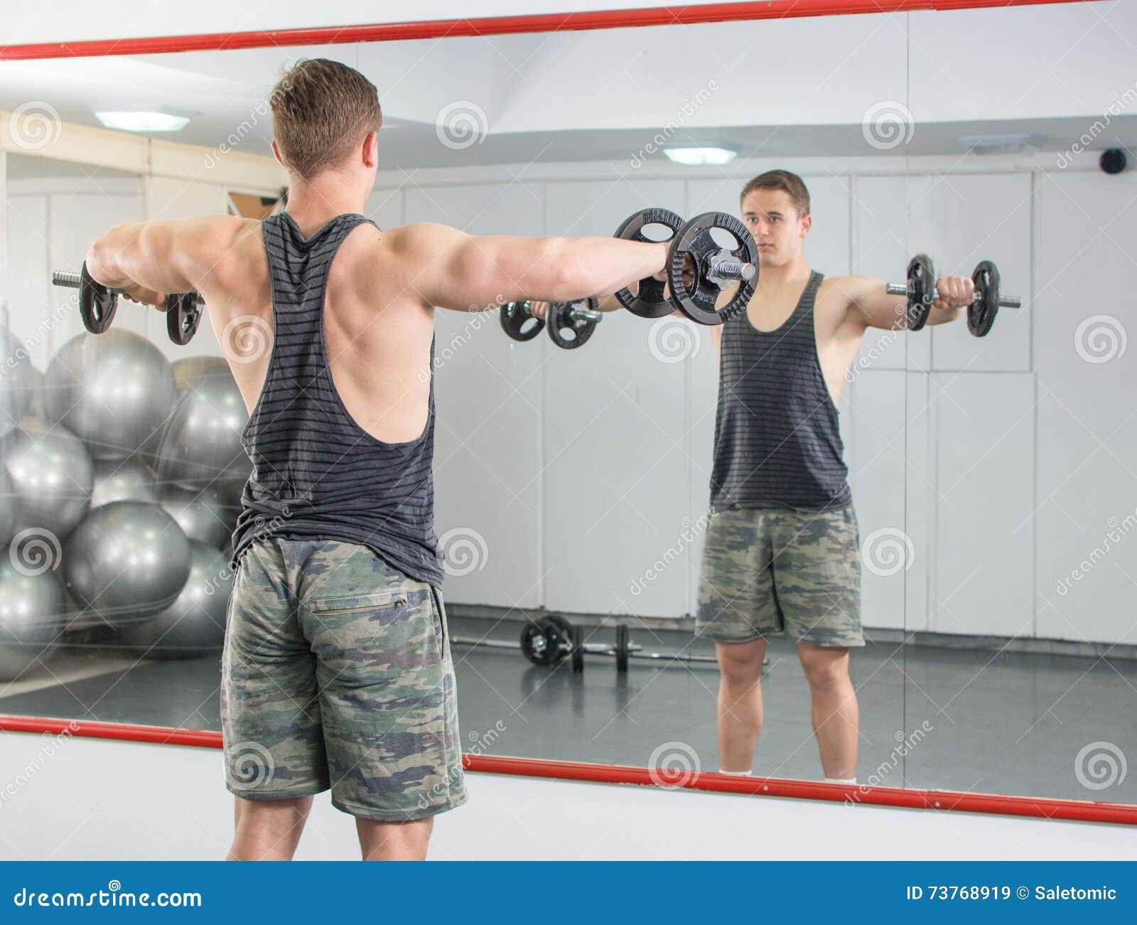 Man Performing Shoulder Workout at the Gym Stock Image - Image of ...