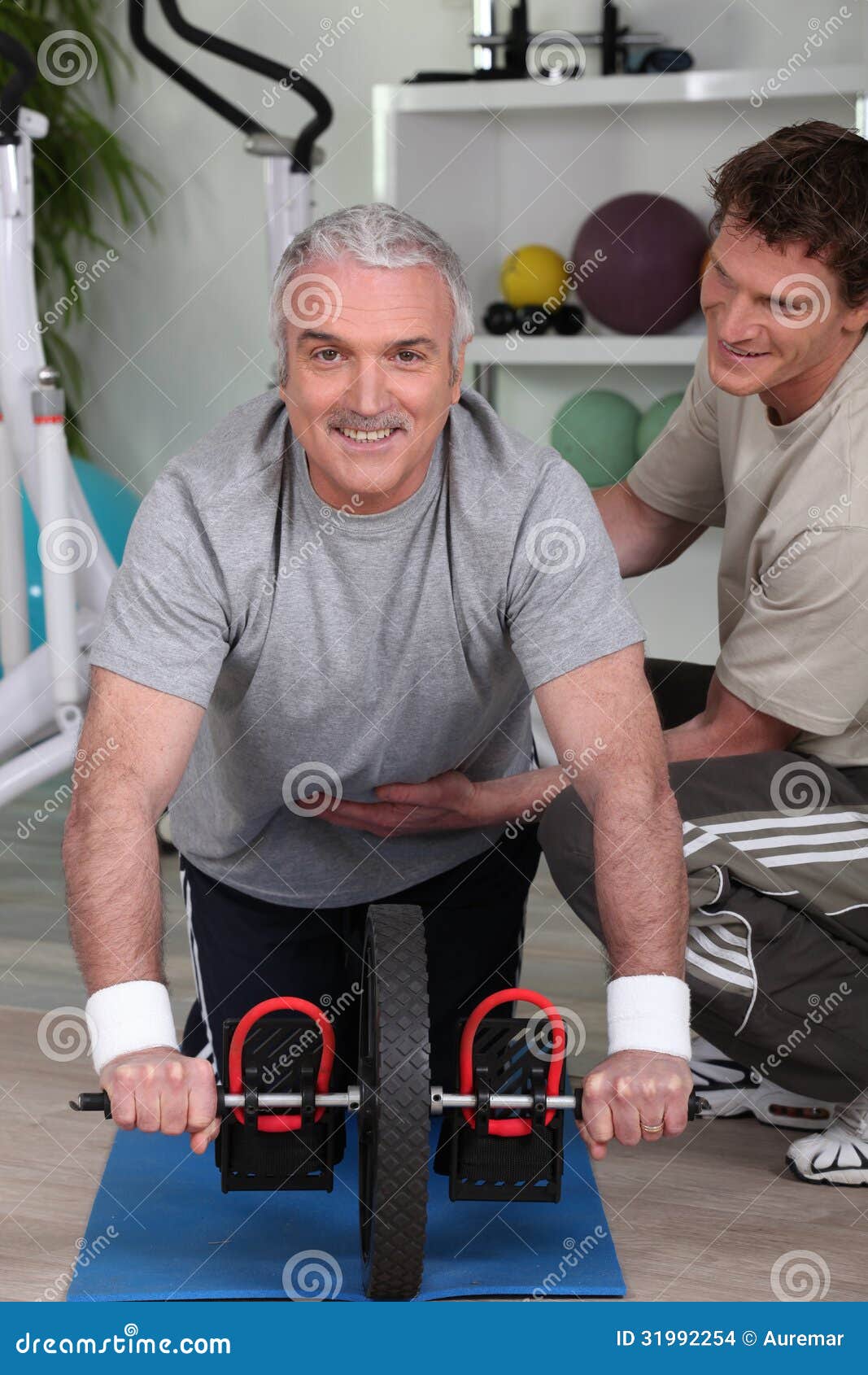 Man with personal trainer stock photo. Image of strong - 31992254