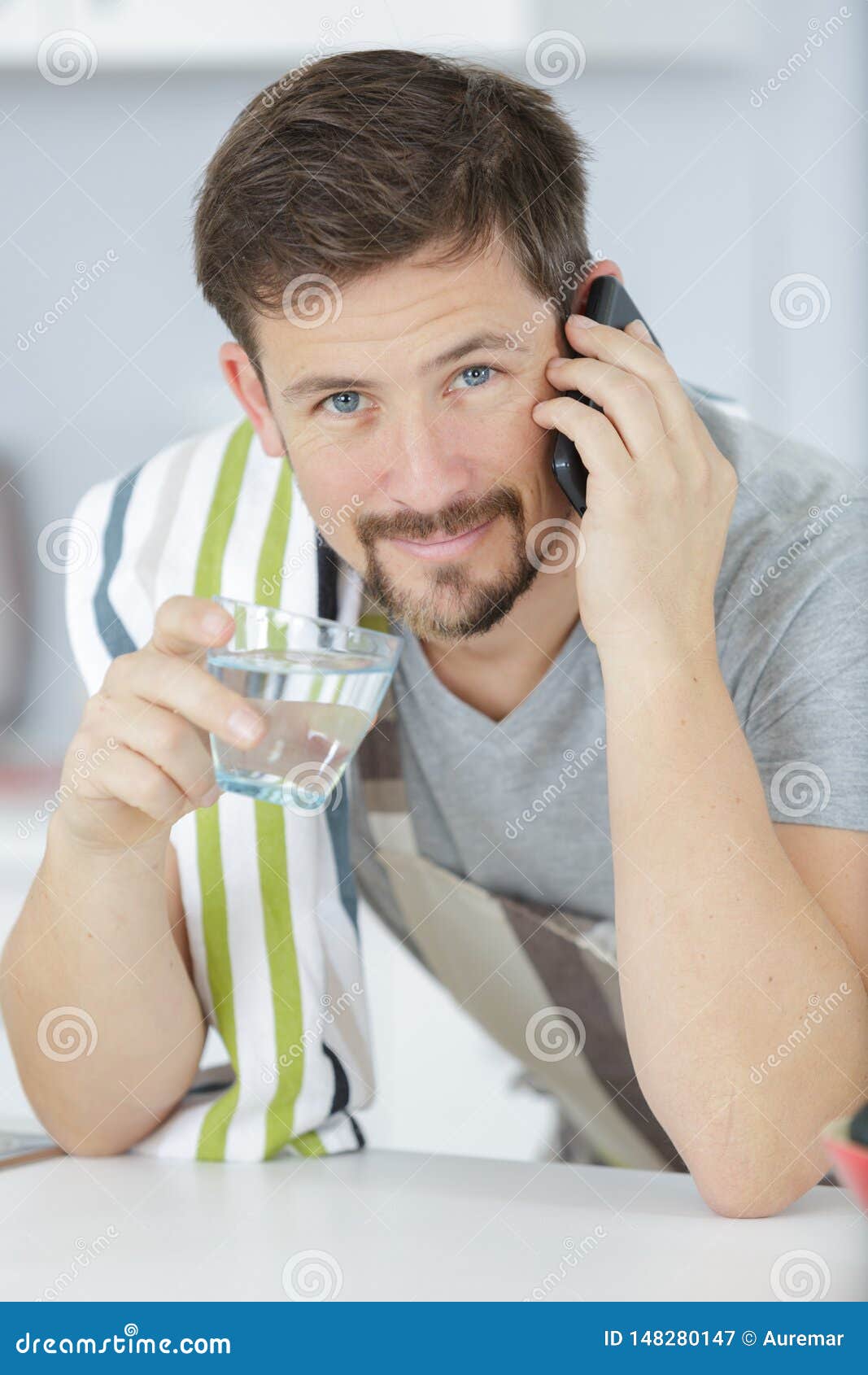 Man on Phone after Doing Home Tasks Stock Image - Image of domestic ...