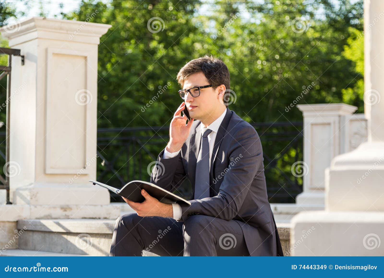 Man on Phone Holding Notepad Stock Image - Image of cellphone ...