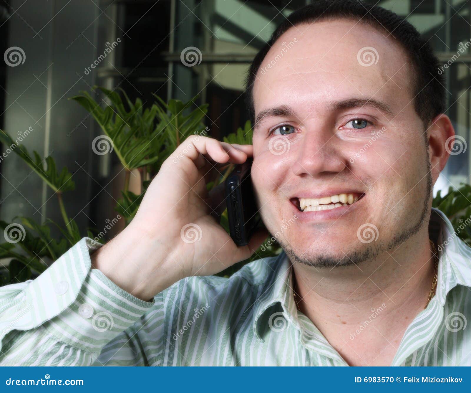 Man on the phone smiling stock photo. Image of young, white - 6983570