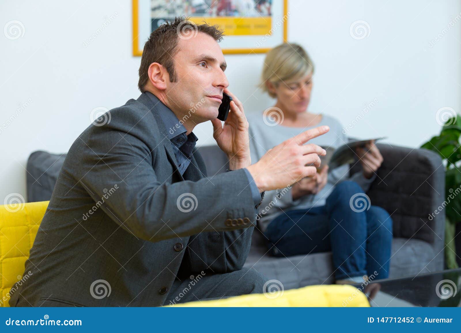 Man on phone while waiting stock photo. Image of background - 147712452