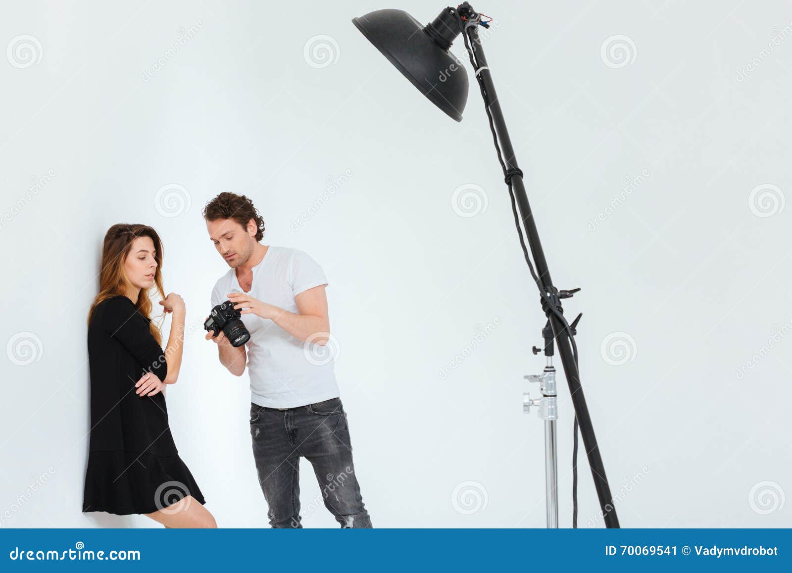 Man Photograph and Female Model Looking on Camera Screen Stock Image ...