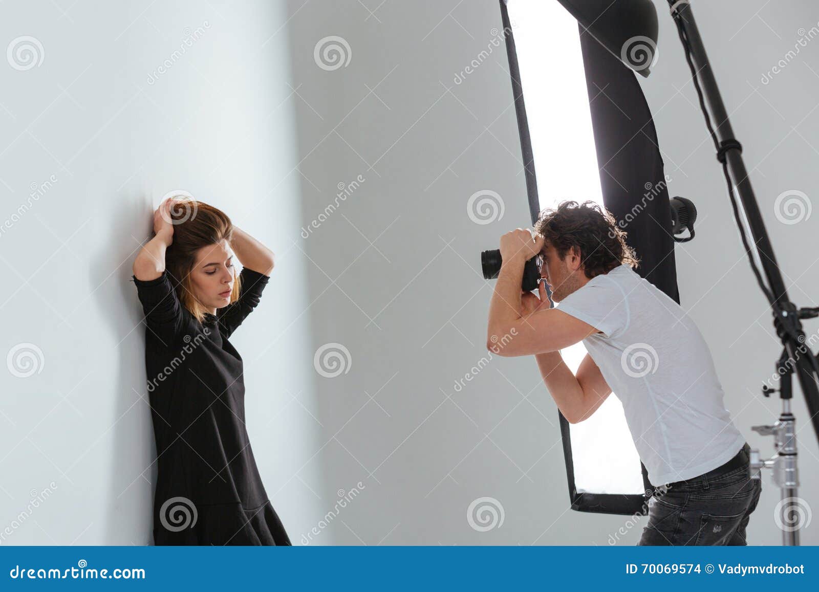 Man Photographing Female Model in Professional Studio Stock Photo ...