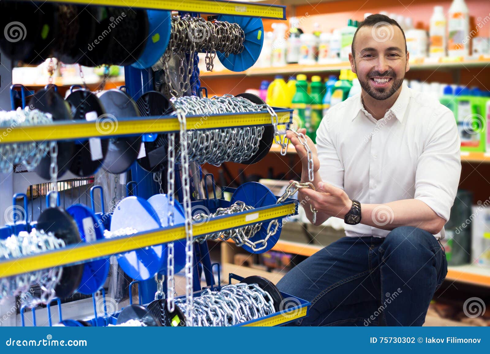 Man picking metallic chain stock photo. Image of retail - 75730302