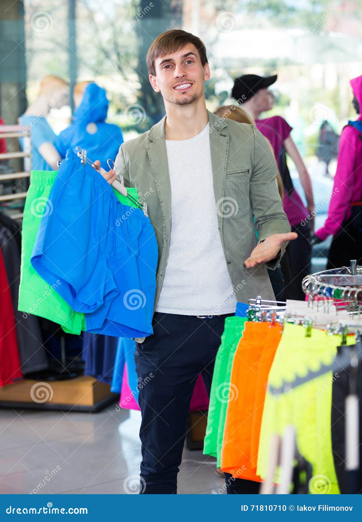 Man Picking a Sport Clothes Stock Photo - Image of demonstrating ...