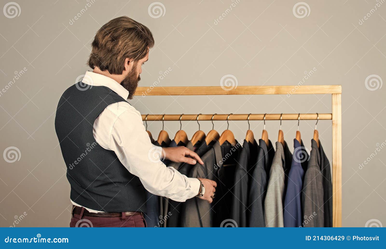 Man Picking Suit from Personal Wardrobe, Tailored Clothes Concept Stock ...