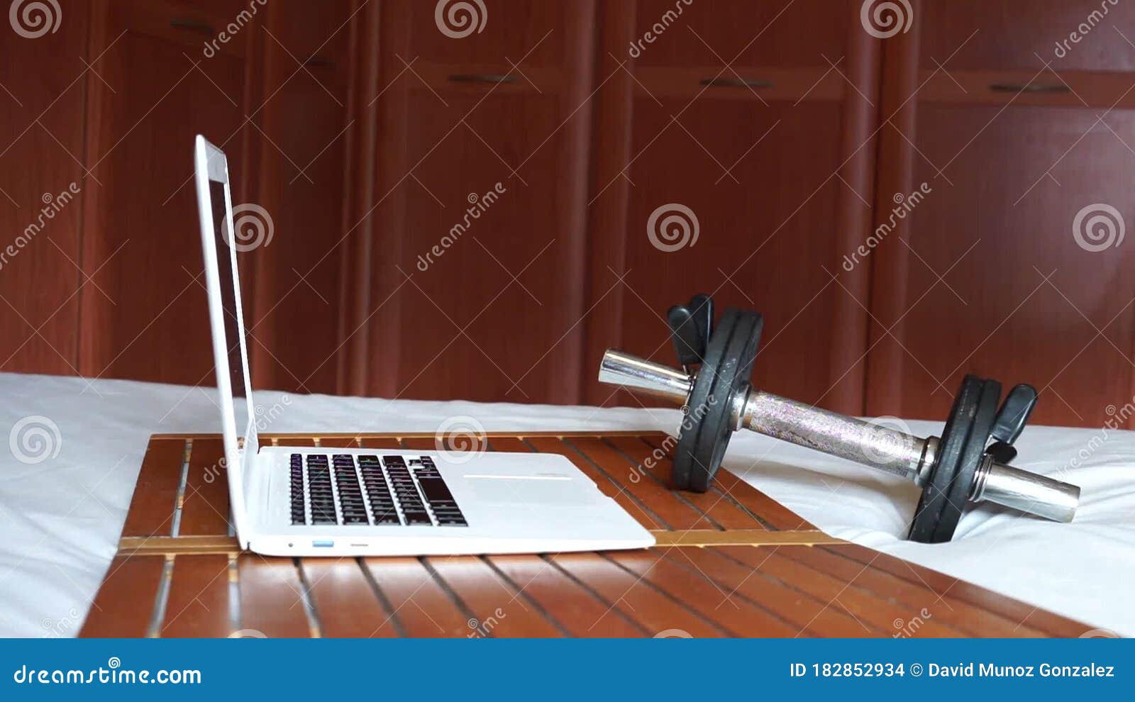 Man Picking Up a Dumbbell in Front of the Computer. Stock Footage ...