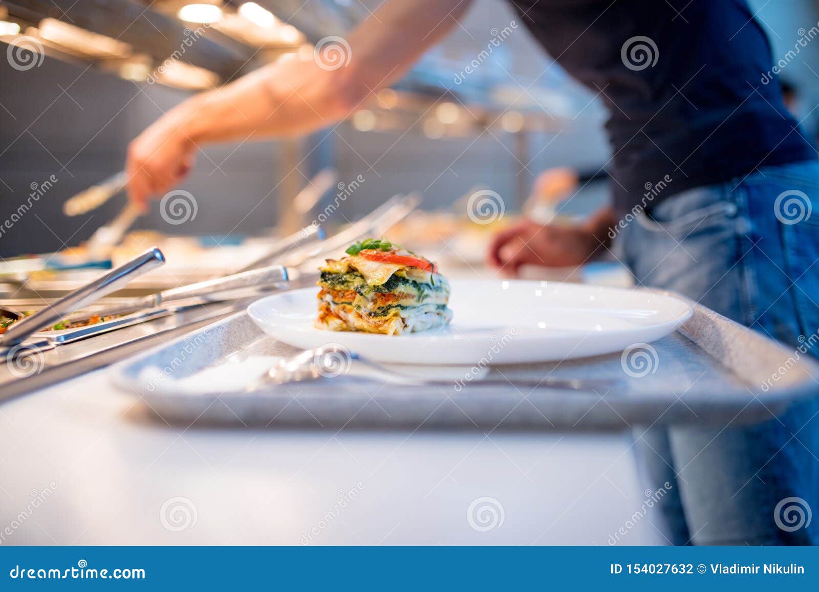 Man Picks Up Food at the Buffet Stock Photo - Image of restaurant ...