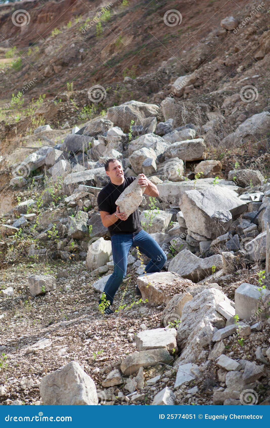 The man picks up a stone stock image. Image of person - 25774051