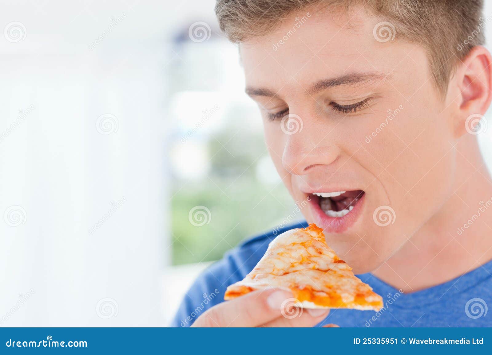 A Man with a Piece of Pizza Near His Mouth Stock Image - Image of ...