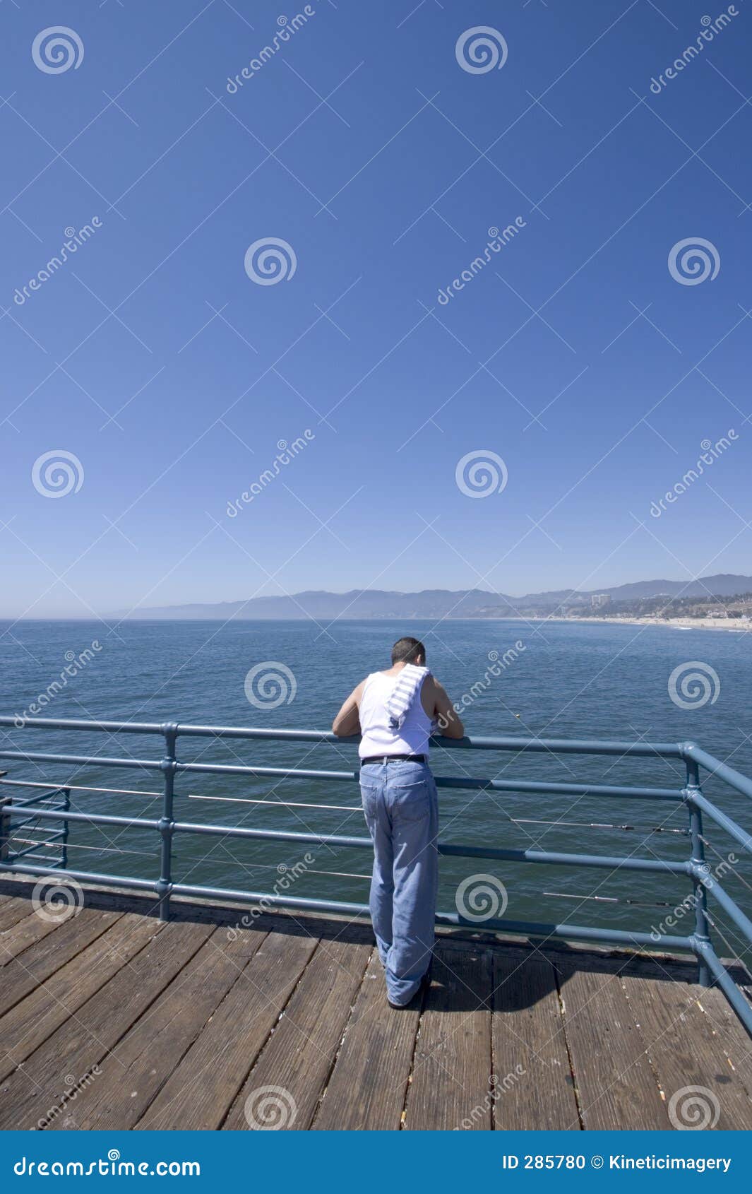 Man on pier stock photo. Image of reflect, coast, coastline - 285780