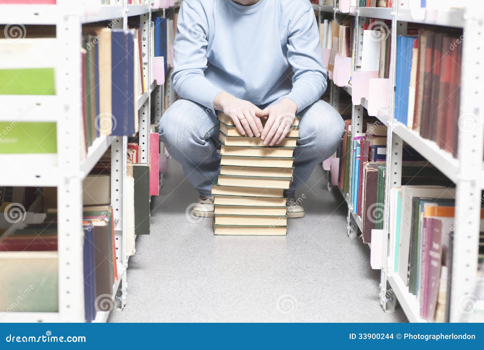 Man with Pile of Books in Library Stock Photo - Image of indoors ...