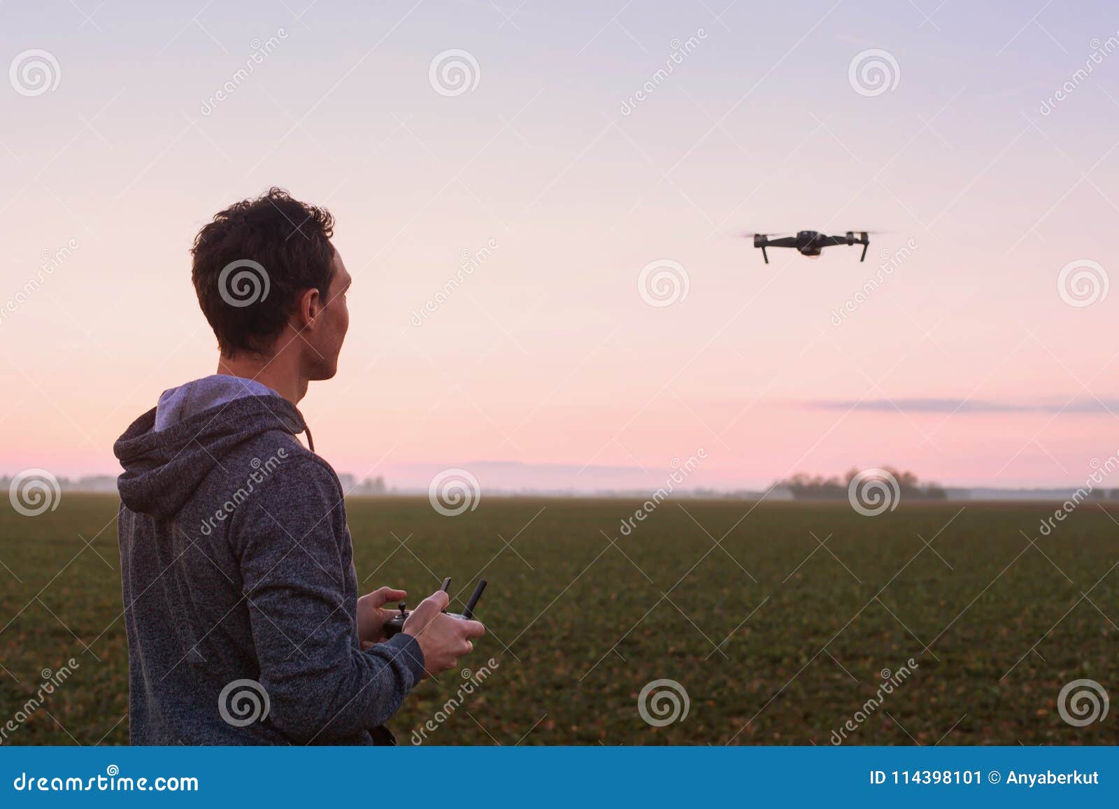 Man piloting drone stock image. Image of propeller, high - 114398101