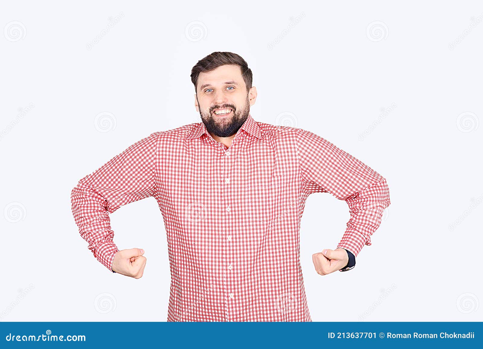 Man in a Pink Checkered Shirt Shows Off His Biceps. a Guy with a Beard ...
