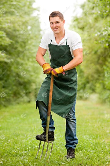 Man with pitchfork stock photo. Image of tool, garden - 20842186