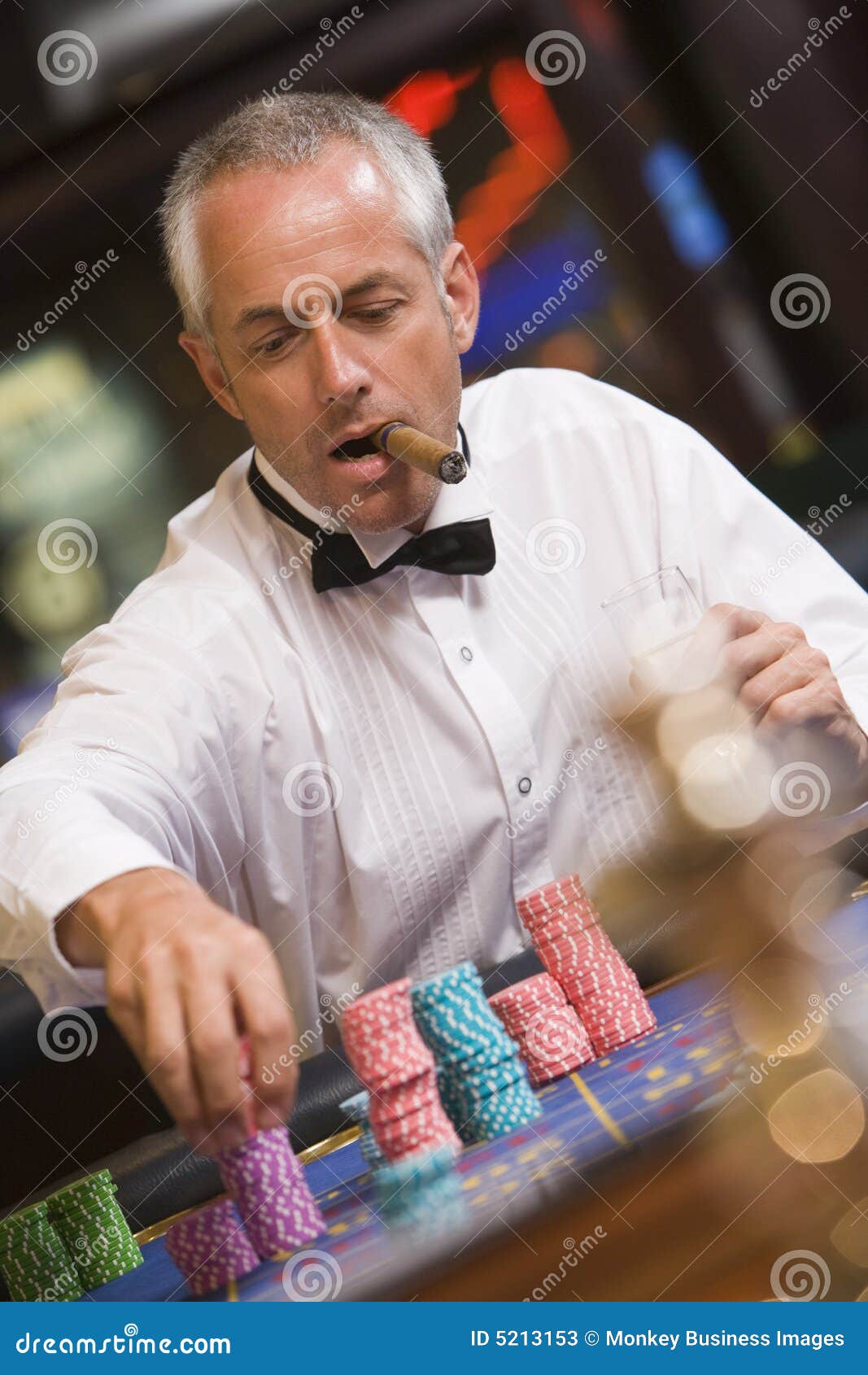 Man Placing Bet at Roulette Table Stock Image - Image of champagne ...
