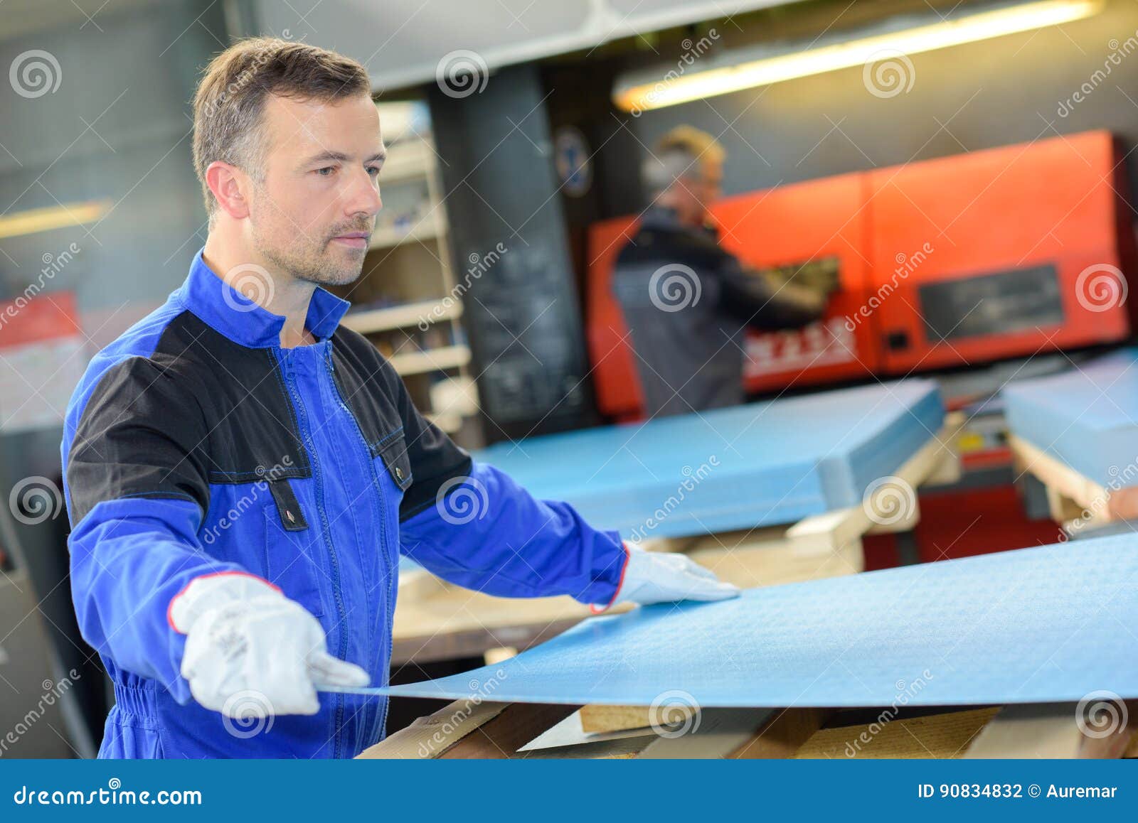 Man Placing Sheetmetal Onto Pallet Stock Photo - Image of machinery ...