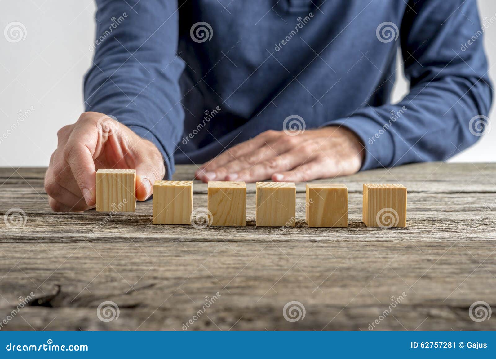 Man Placing Six Blank Wooden Cubes in a Row Stock Image - Image of ...