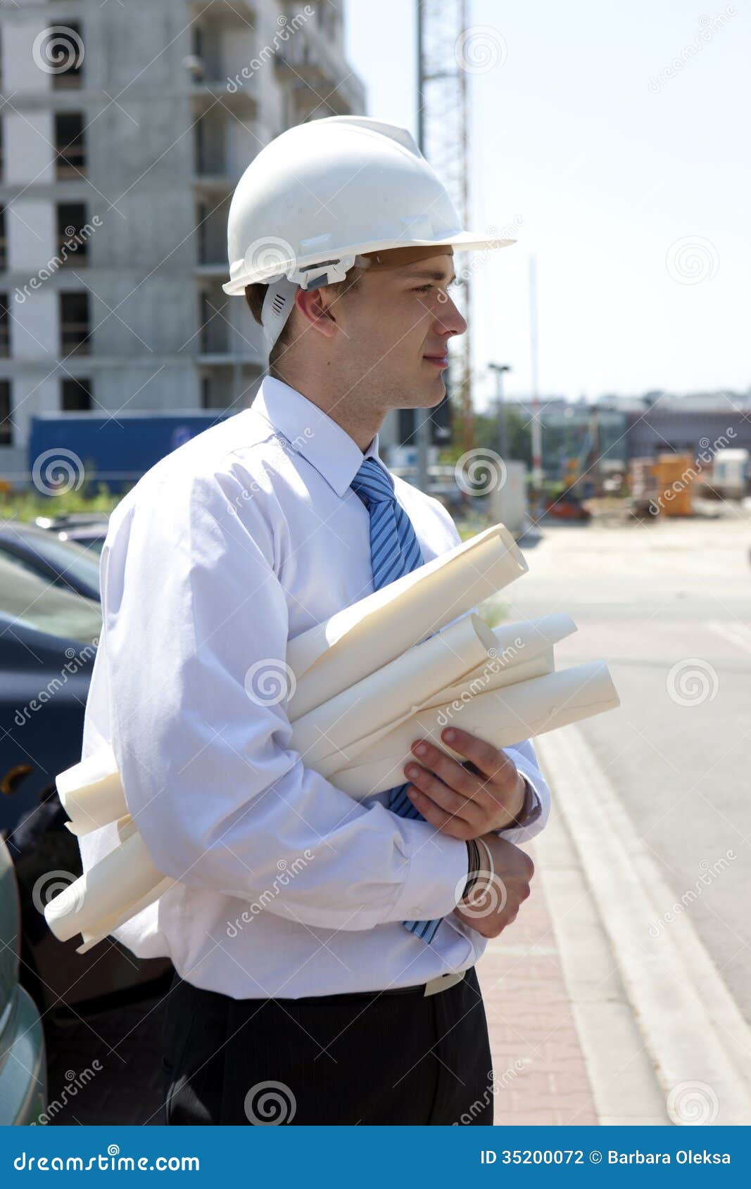 Man with Plans on Construction Site Stock Photo - Image of project ...