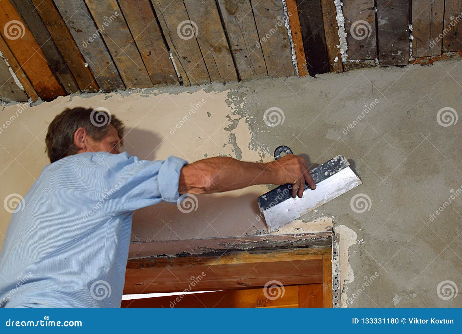 A man plastering a wall stock photo. Image of indoors - 133331180