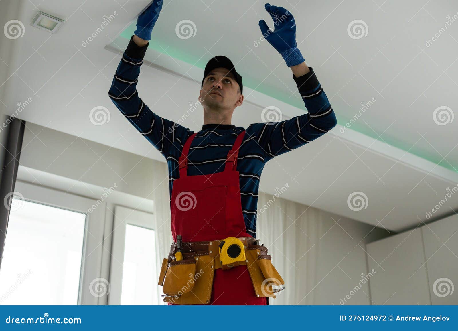 Man Plasterer Construction Worker at Work, Takes Plaster from Bucket ...