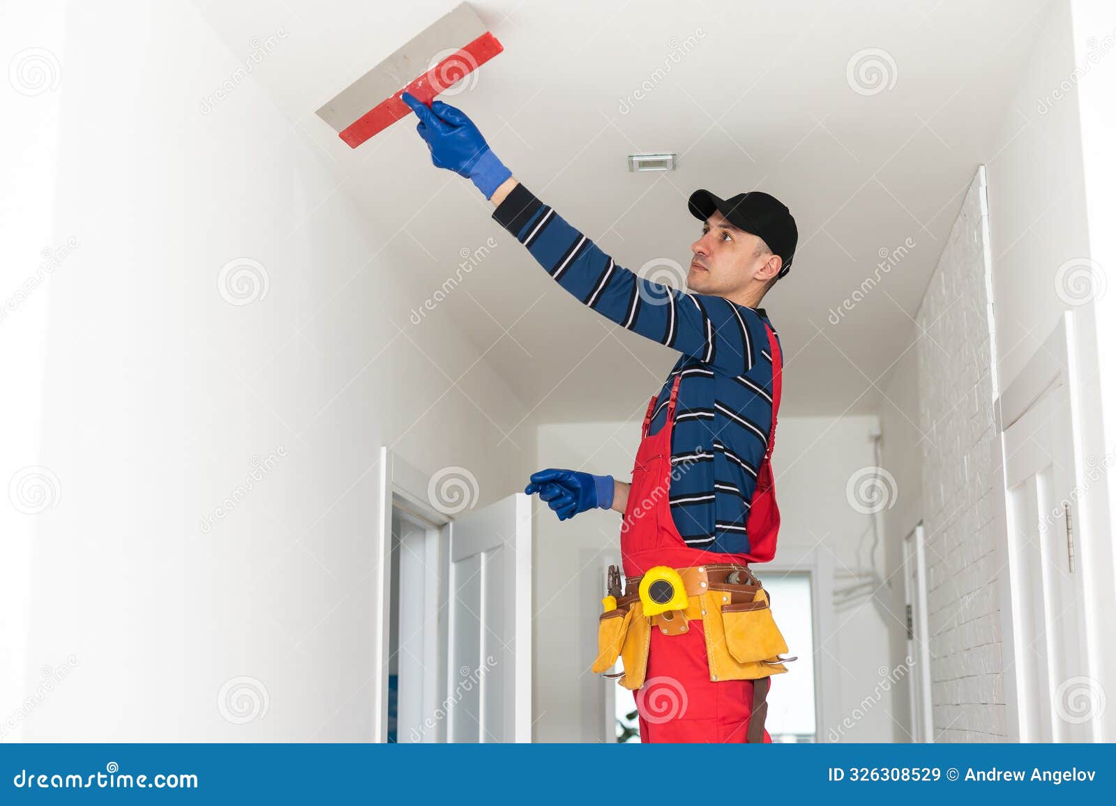 Man Plasterer Construction Worker at Work, Takes Plaster from Bucket ...