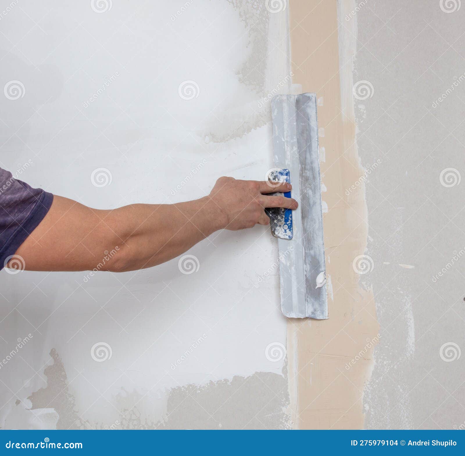 A Man is Plastering a Wall in the House Stock Photo - Image of ...