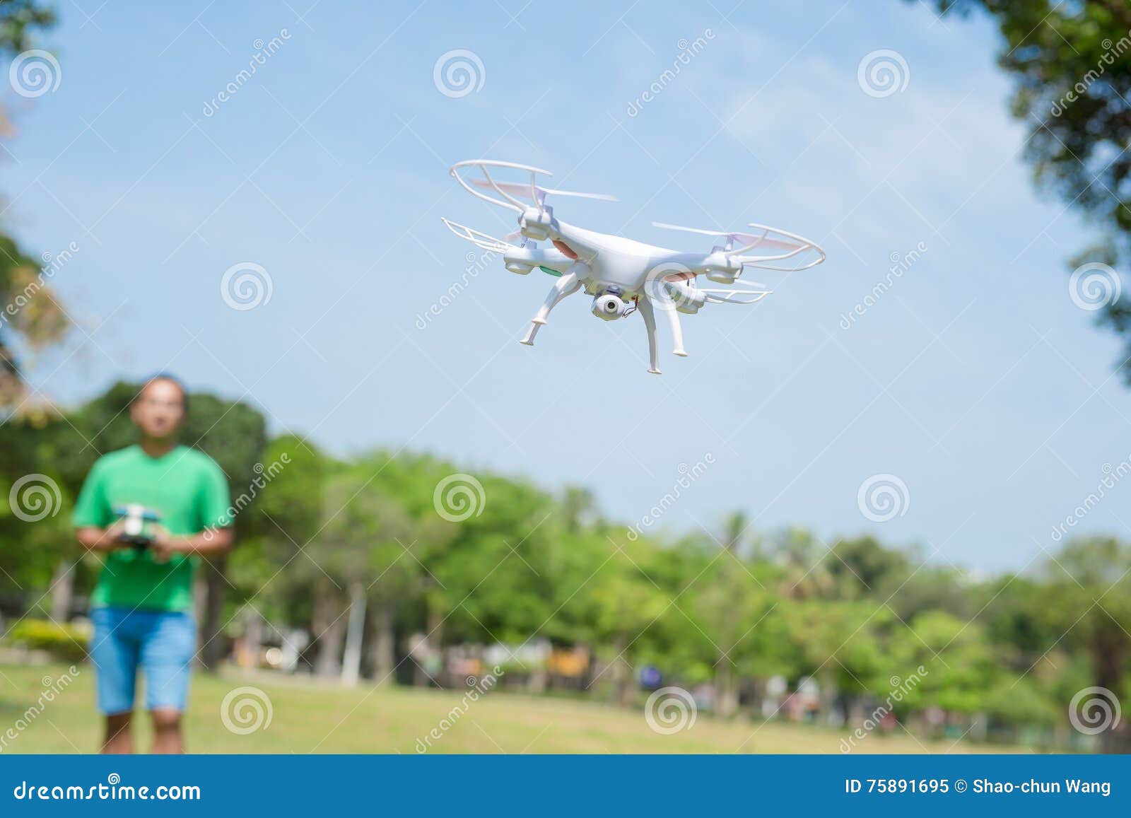 Man play drone in park stock image. Image of remote, grass - 75891695