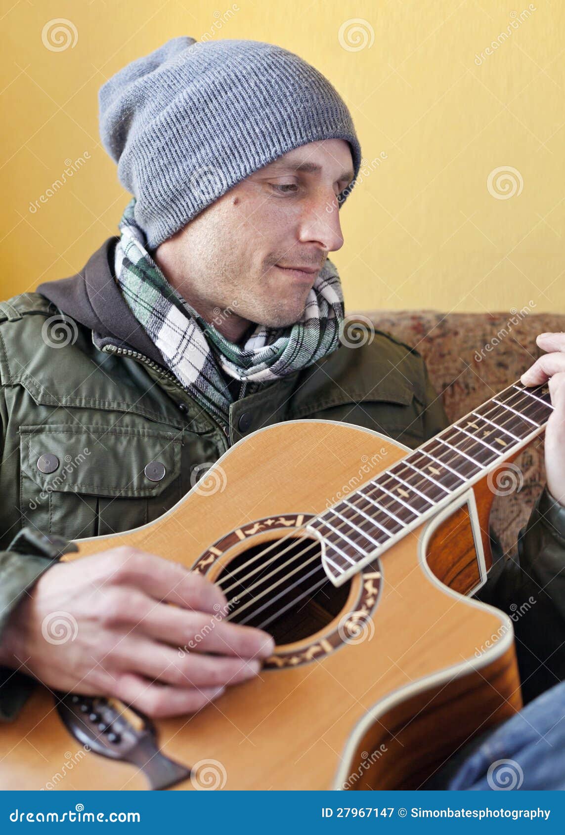 Man Playing Acoustic Guitar Stock Image - Image of beanie, talent: 27967147