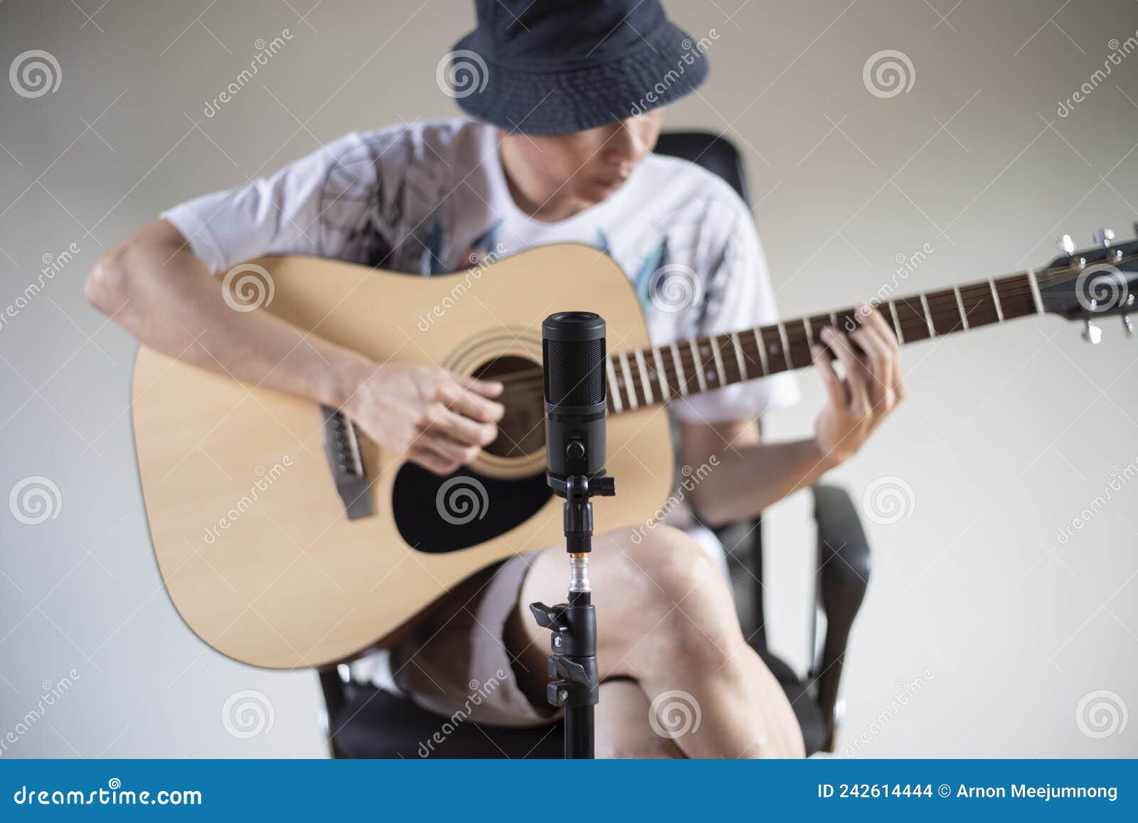 Man Playing Acoustic Guitar through Front Microphone. Stock Photo ...