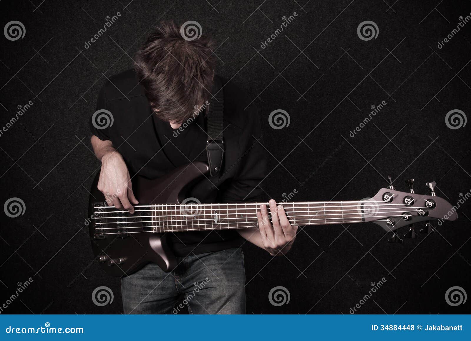 Man Playing on Bass Guitar in Studio Stock Photo - Image of dark, play ...