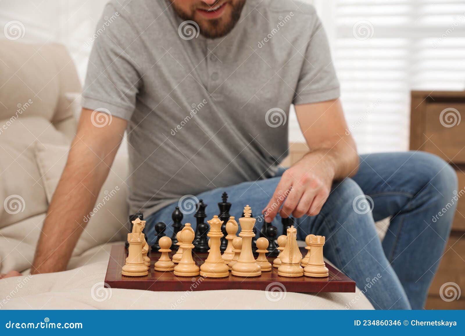 Man Playing Chess Alone on Sofa at Home, Closeup Stock Photo - Image of ...