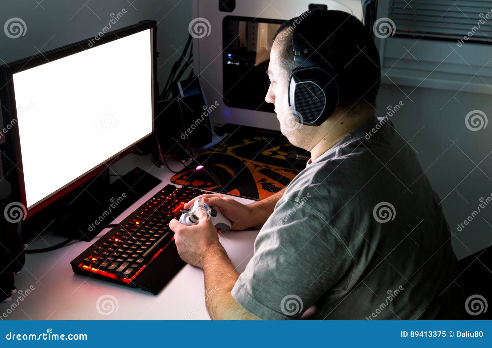 Man Playing Computer Game On Custom Made Desktop With Joypad, Keyboard ...